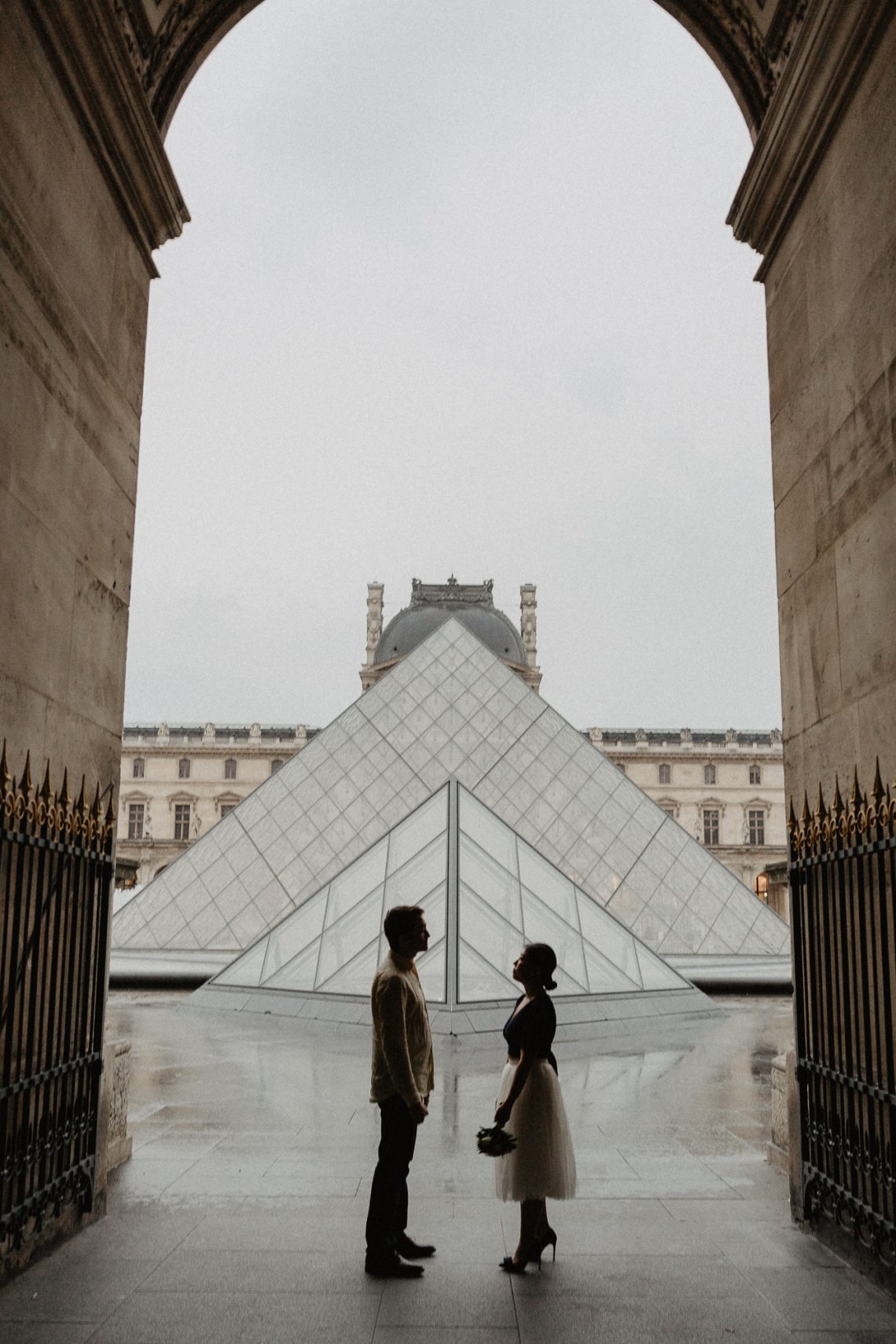 Paris couple photos in the rain | Through The Glass Paris